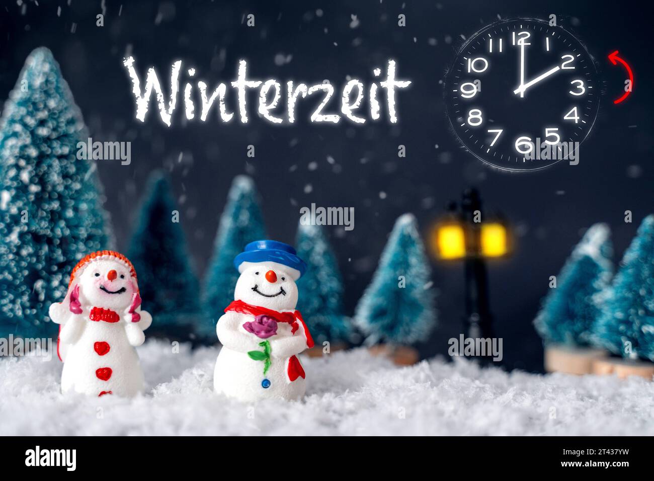 28 October 2023: Snow landscape with snowmen during snowfall in winter ...