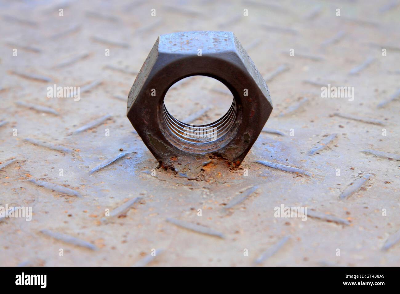 steel nut welding on the steel plate Stock Photo - Alamy