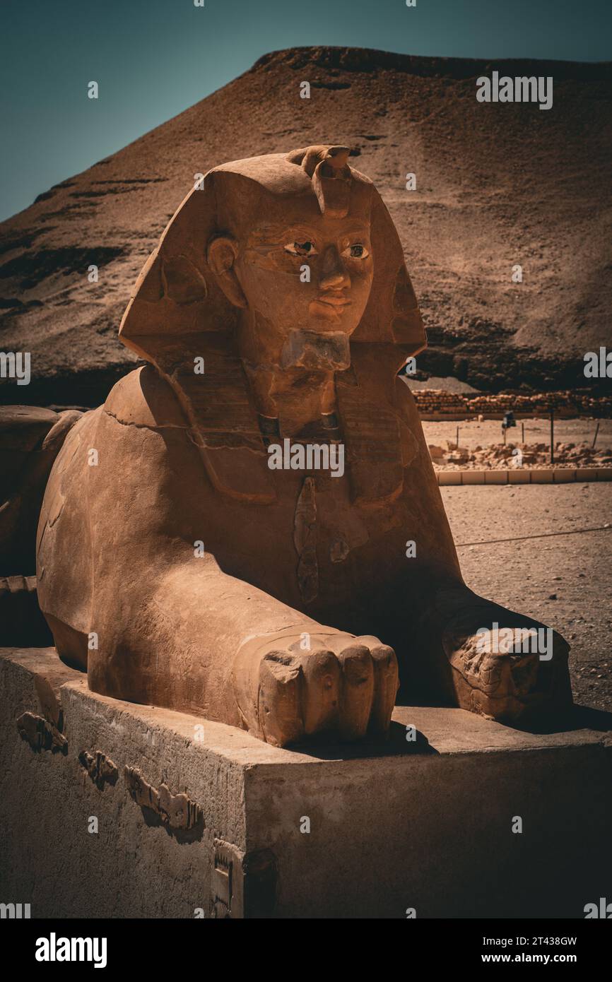 A sphinx sculpture guards the entrance to the Temple of Hatshepsut ...