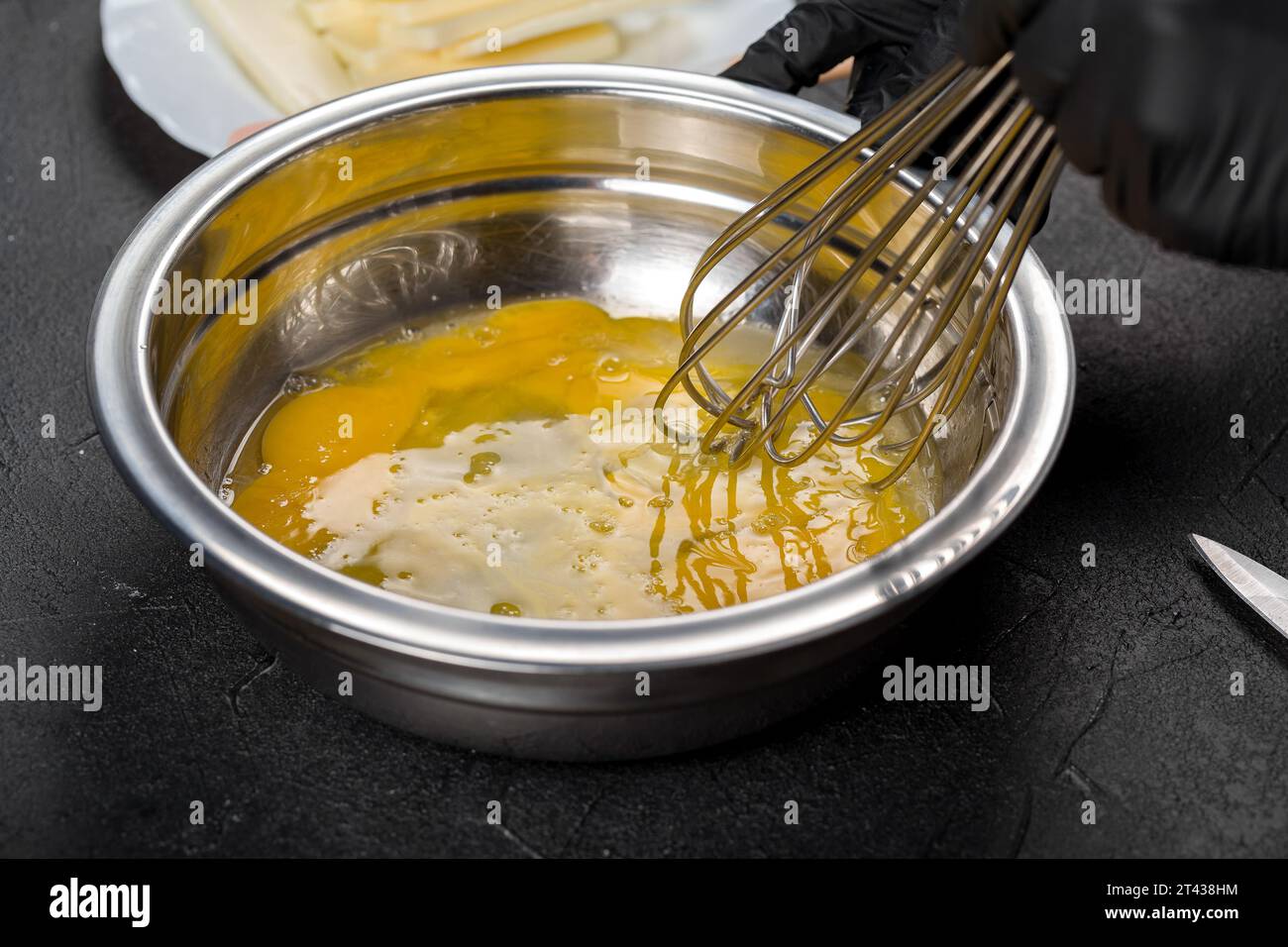 Egg whites beaten to a frothy stage an hand whisk. Finished beating egg ...