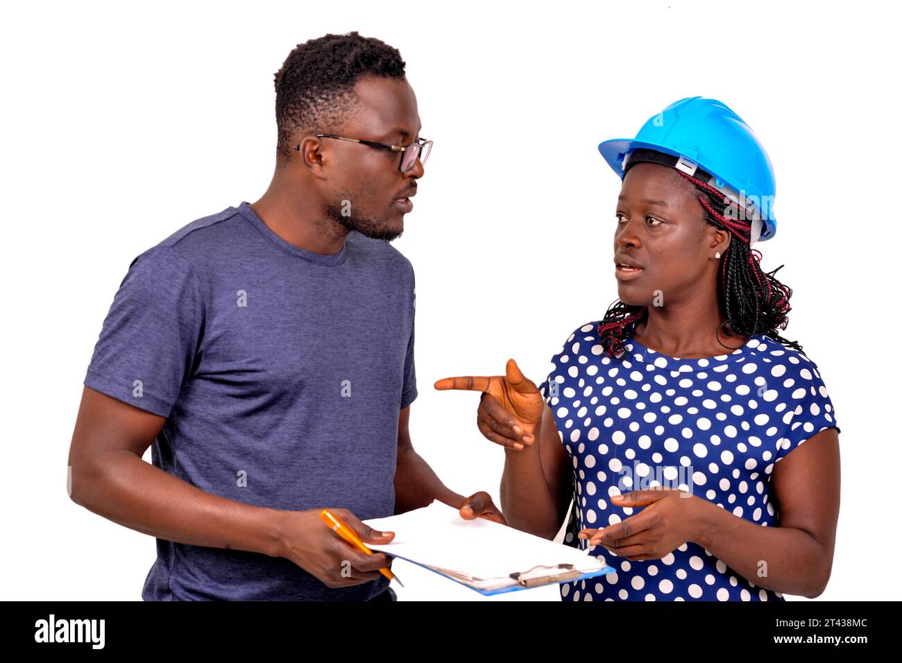 two young construction engineers working on a project together. man ...