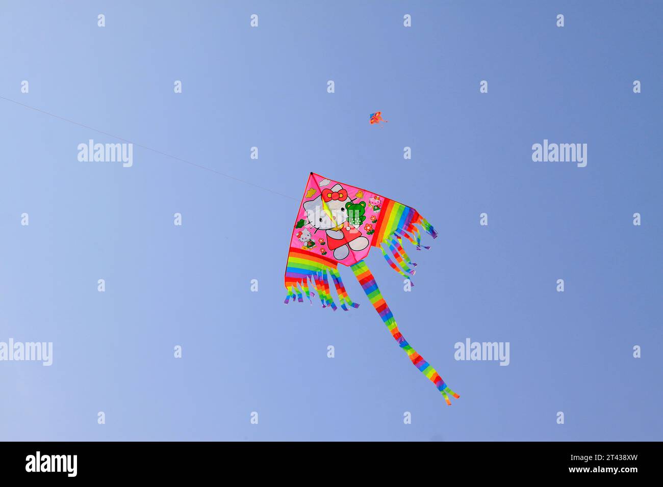 Cartoon characters modelling kite in the sky Stock Photo - Alamy