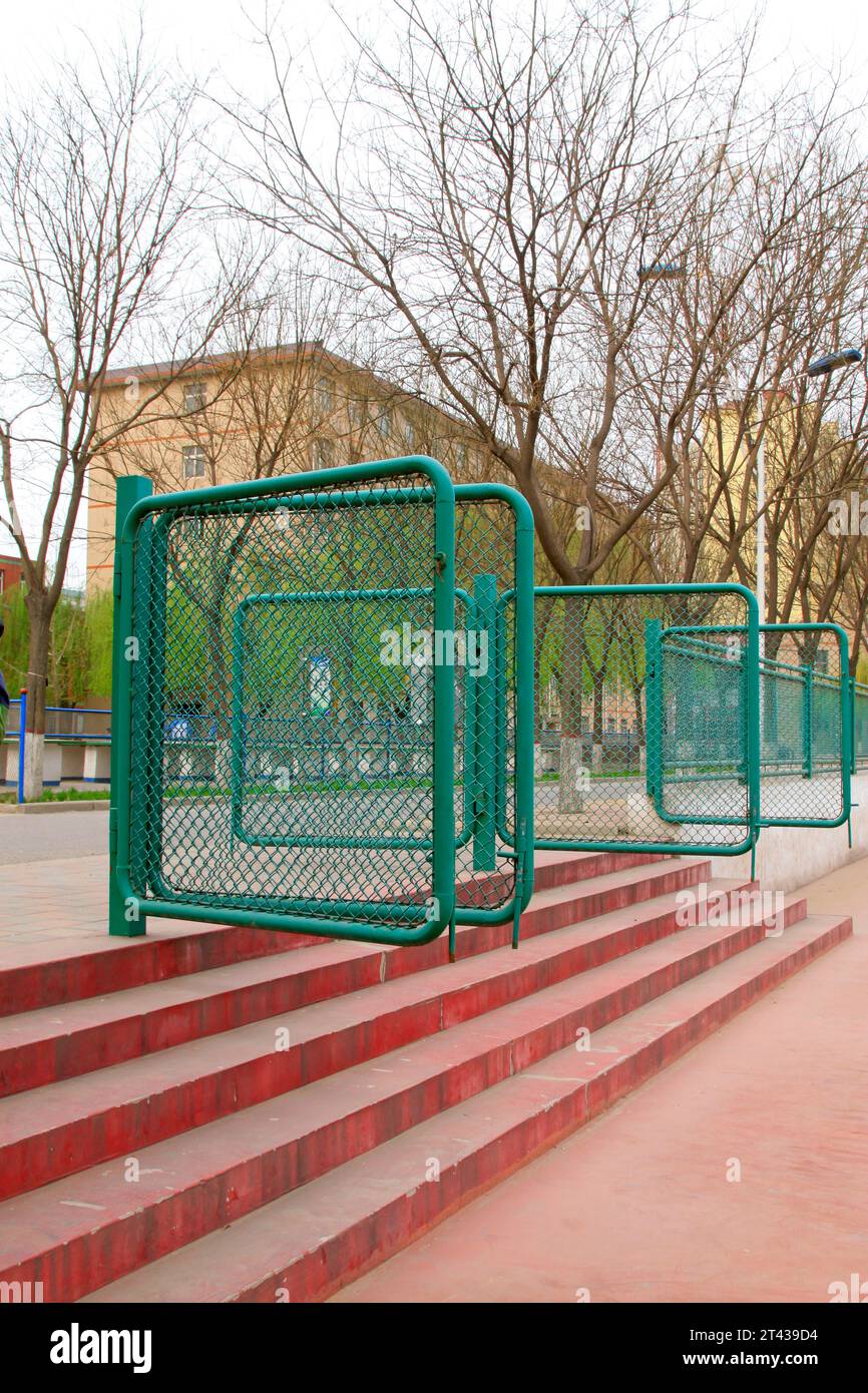 Steel wire fence gate in a school, china Stock Photo - Alamy
