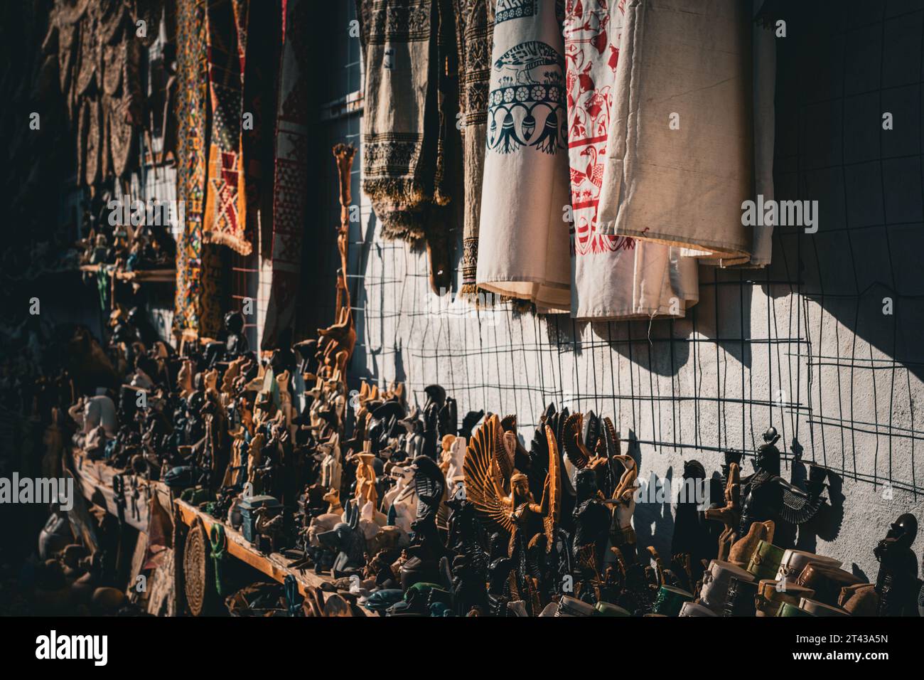 A Nubian market street lined with various stalls selling textiles ...