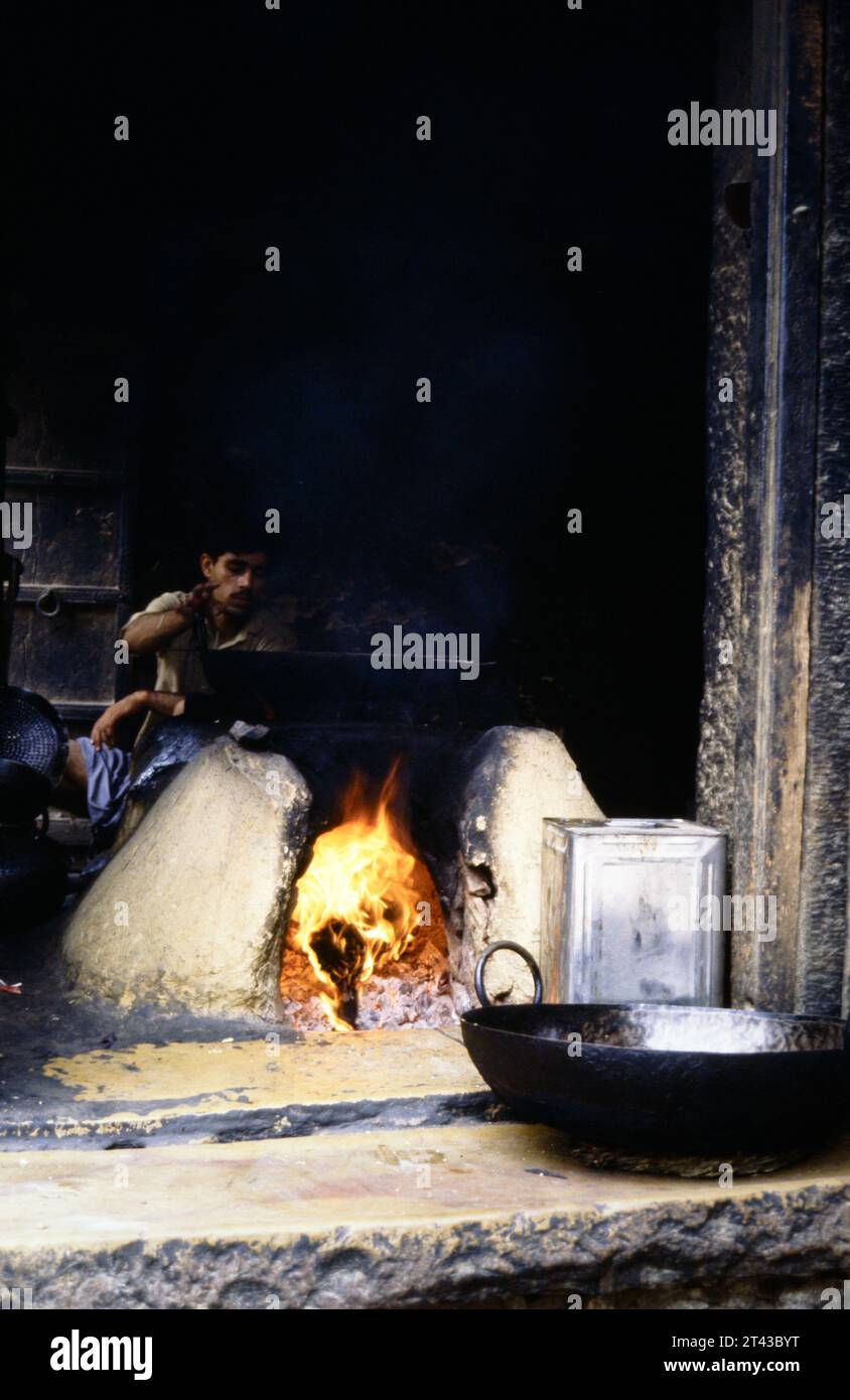 Archive Historic Sweet Maker Or Halwai Making Sweets, Candy In A Metal ...