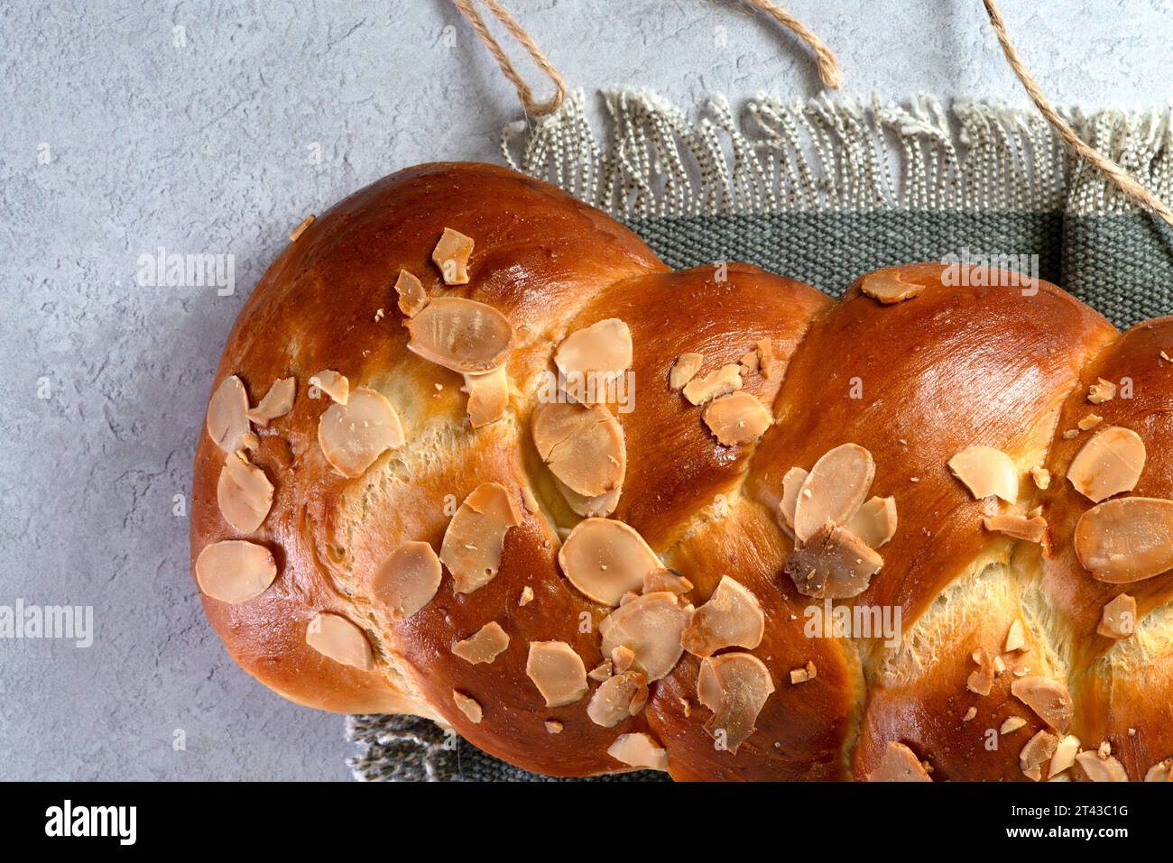 A Challah bread, also known as a Polish Chalka, is shown on a marble ...