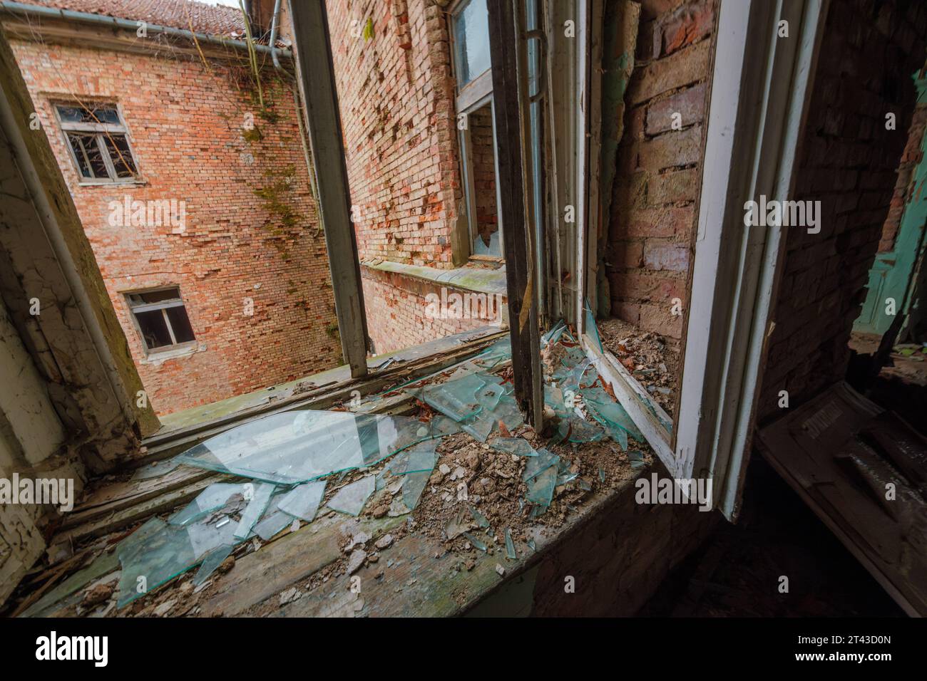 From above metal frame window sill on upstairs with broken transparent ...