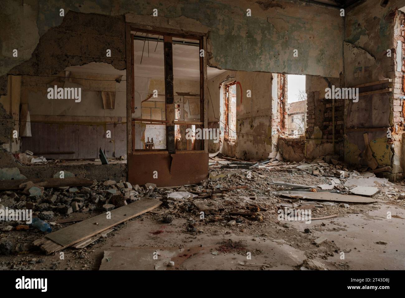 Interior of abandoned spacious room with glass door cabinet and broken ...