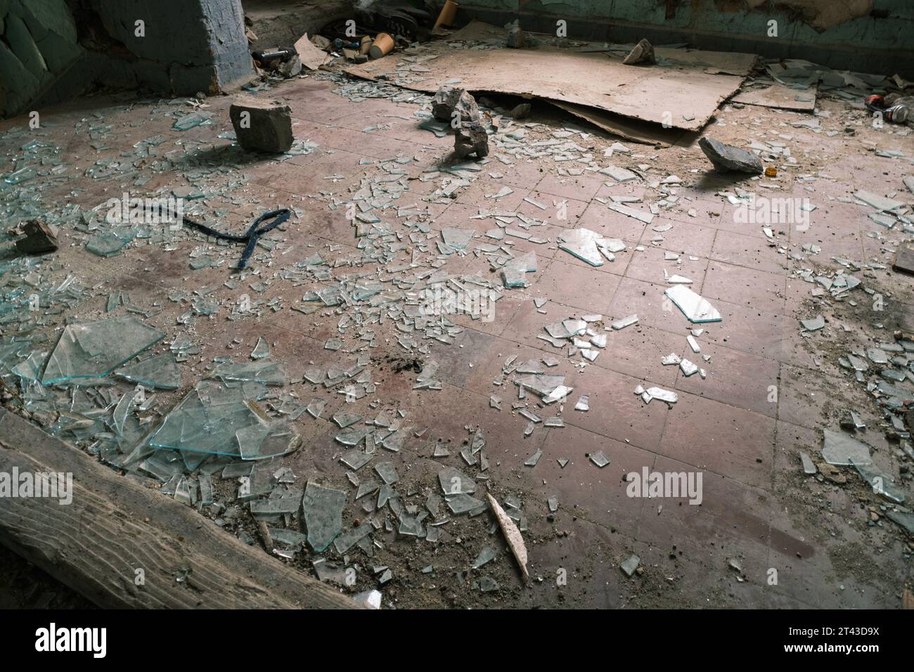 From above of interior of abandoned house with broken transparent ...