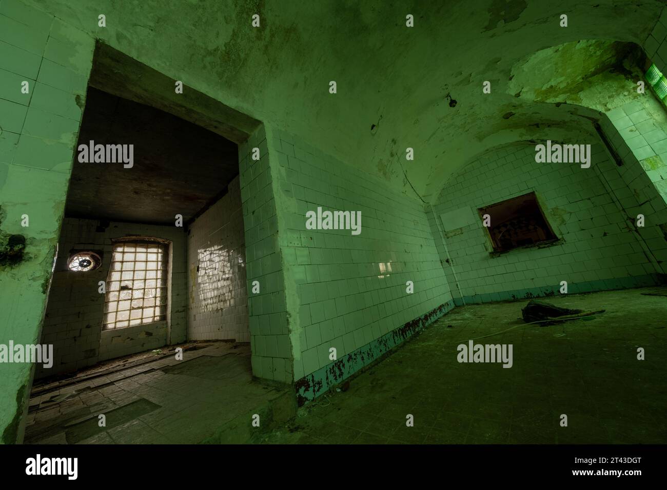 From above interior of cement brick wall building with arched ceiling ...