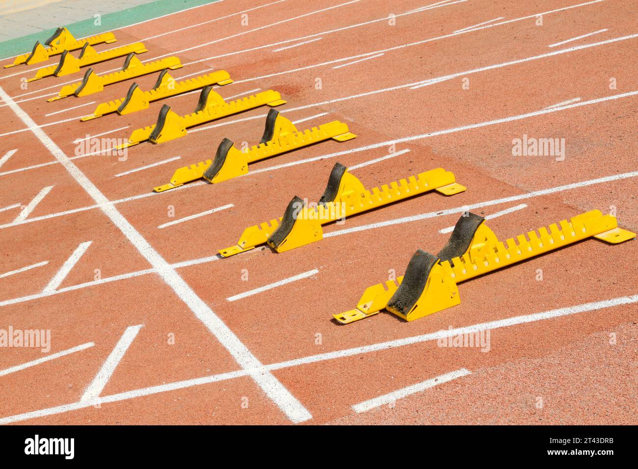 run up ware on red plastic runway in a sports ground in a middle school ...