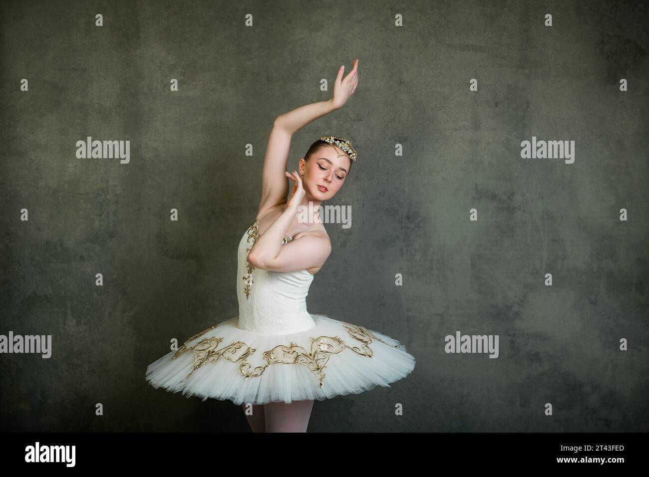 Ballet dancer in white and gold tutu and tiara Stock Photo - Alamy