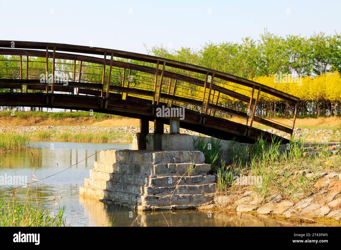wooden arch bridge in a park, closeup of photo Stock Photo - Alamy