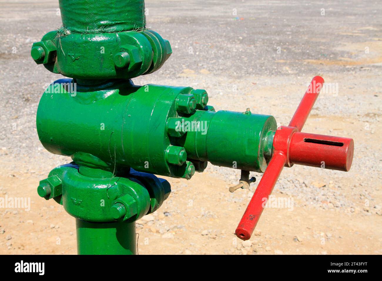green oil pipeline and red bolt rod, closeup of photo Stock Photo - Alamy
