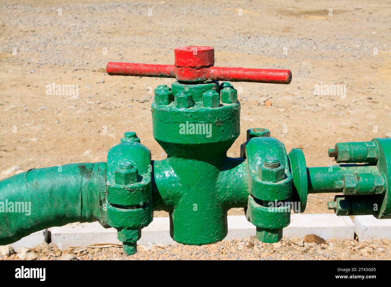 green oil pipeline and red bolt rod, closeup of photo Stock Photo - Alamy