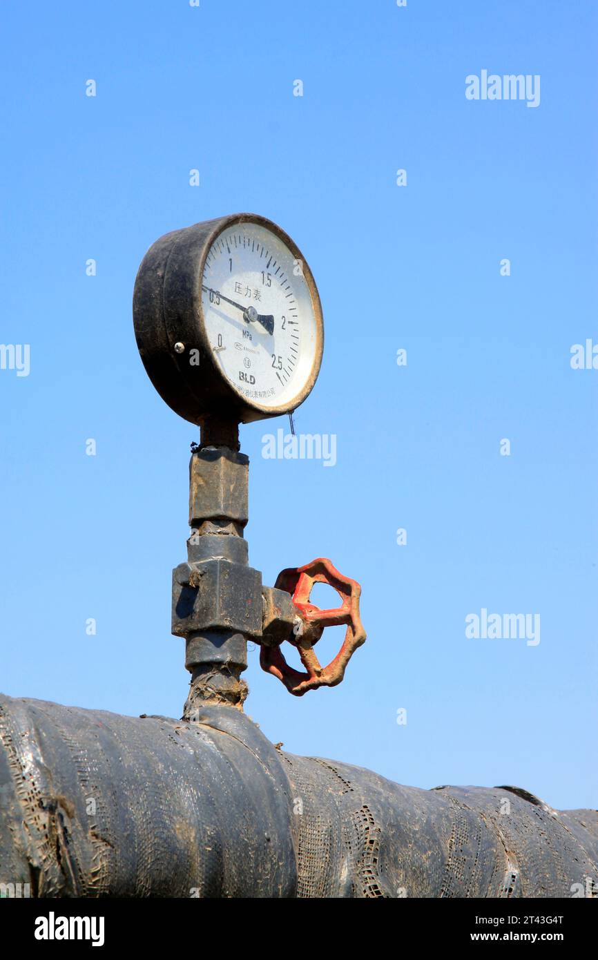 Oil pipe and pressure gauge, closeup of photo Stock Photo - Alamy