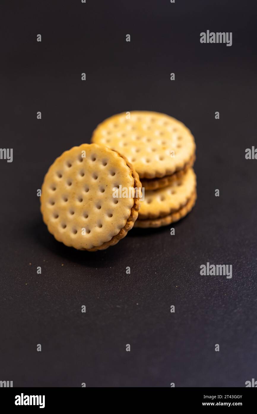 A top down portrait of delicious round cookies stacked on top of each ...