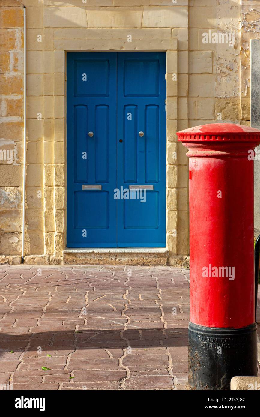 A red post box and blue door on Senglea, one of the three cities of ...