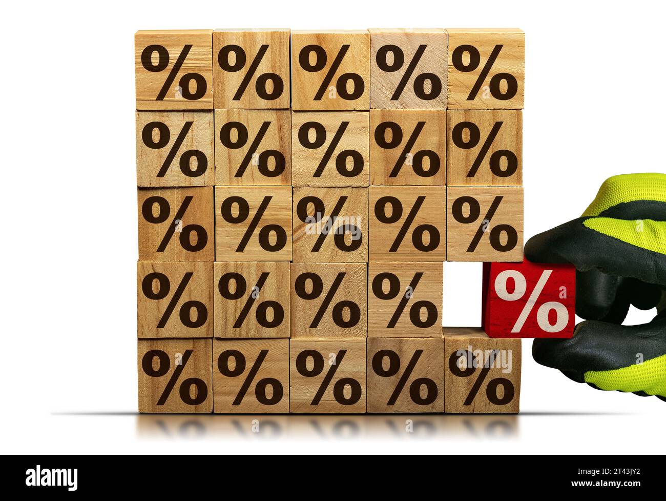Gloved hand chooses a wooden block with red percentage sign, from a ...