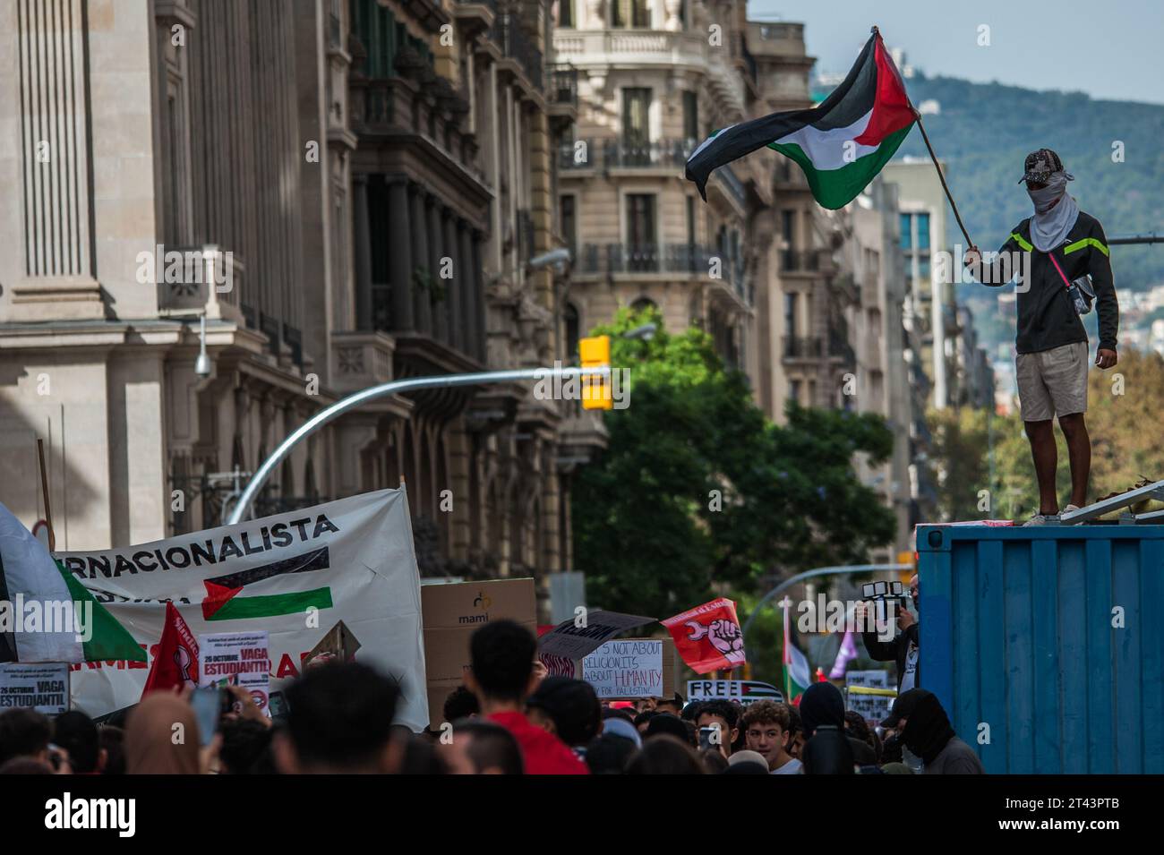 A protester waves a Palestinian flag during the demonstration. The ...