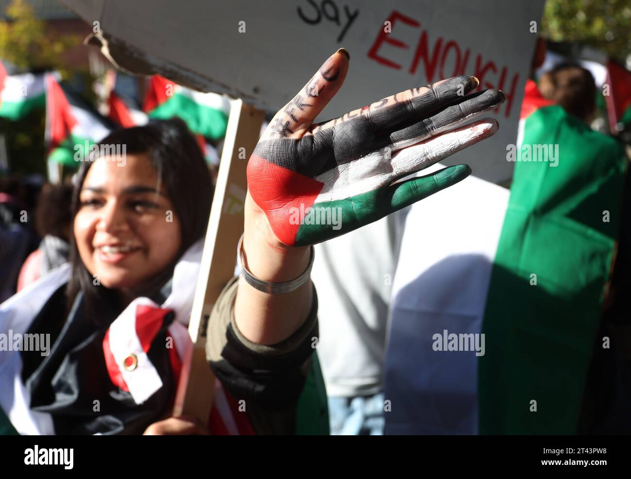 Munich, Germany. 28th Oct, 2023. A demonstrator shows her hand painted ...