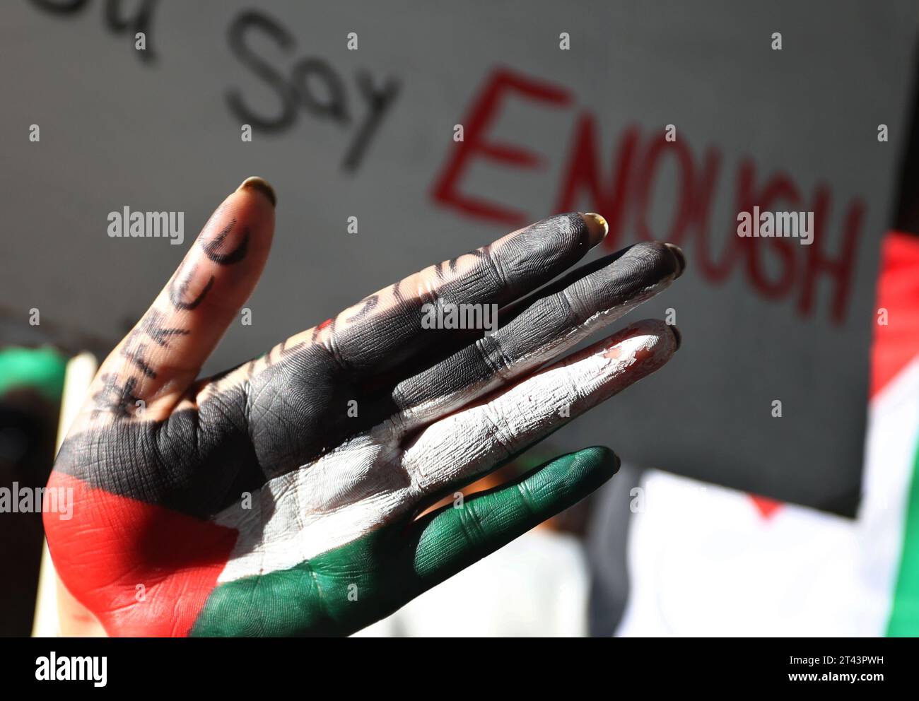 Munich, Germany. 28th Oct, 2023. A demonstrator shows her hand painted ...