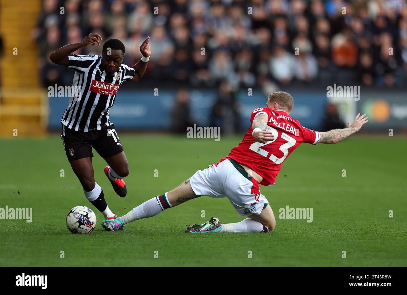 Notts County's Aaron Nemane and Wrexham's James McClean (right) battle ...