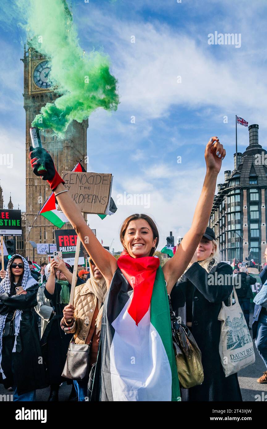 London, UK. 28th Oct, 2023. Smoke flares are let off on Westminster ...
