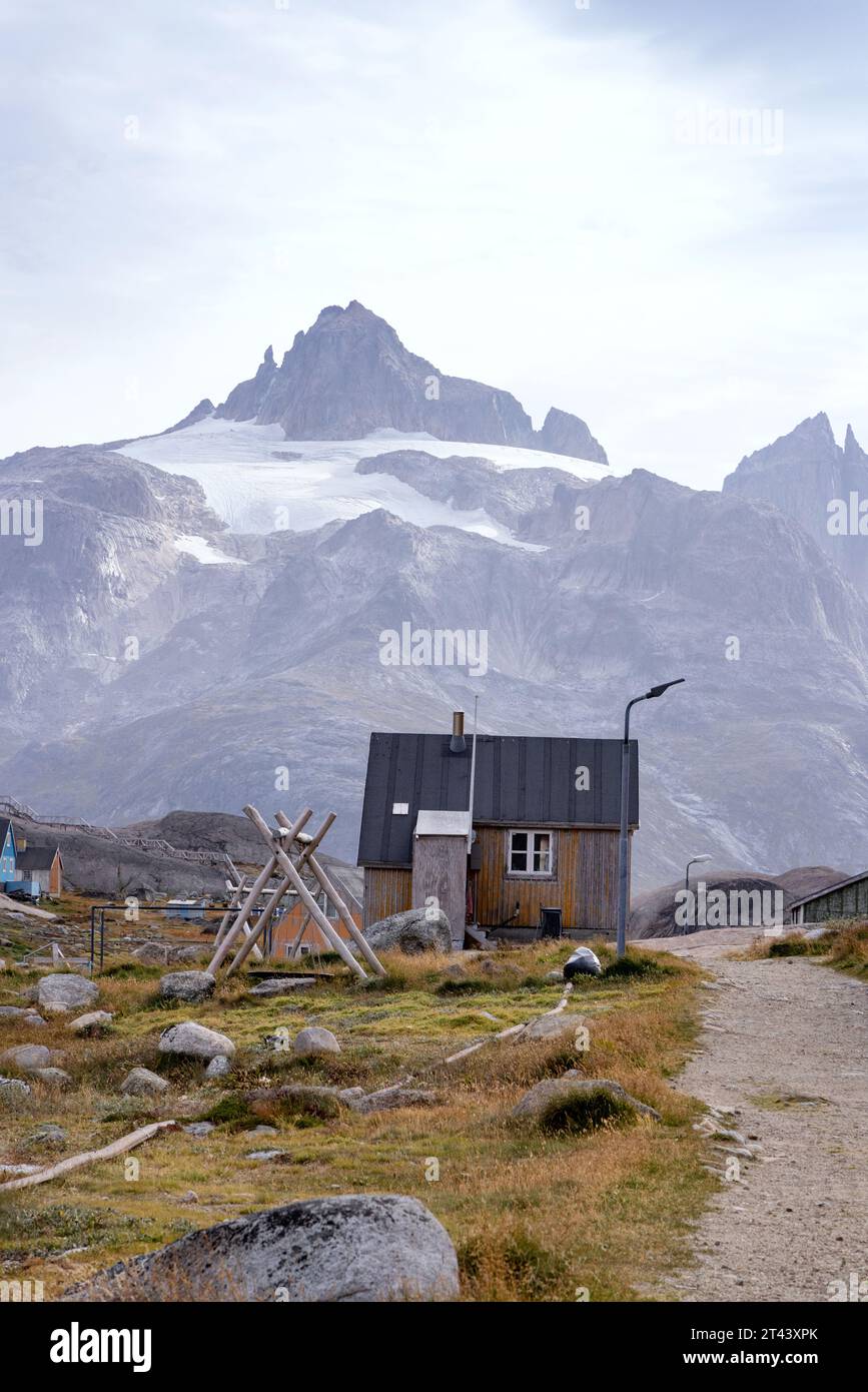 Greenland village; Aappilattoq Inuit village, landscape and mountains ...