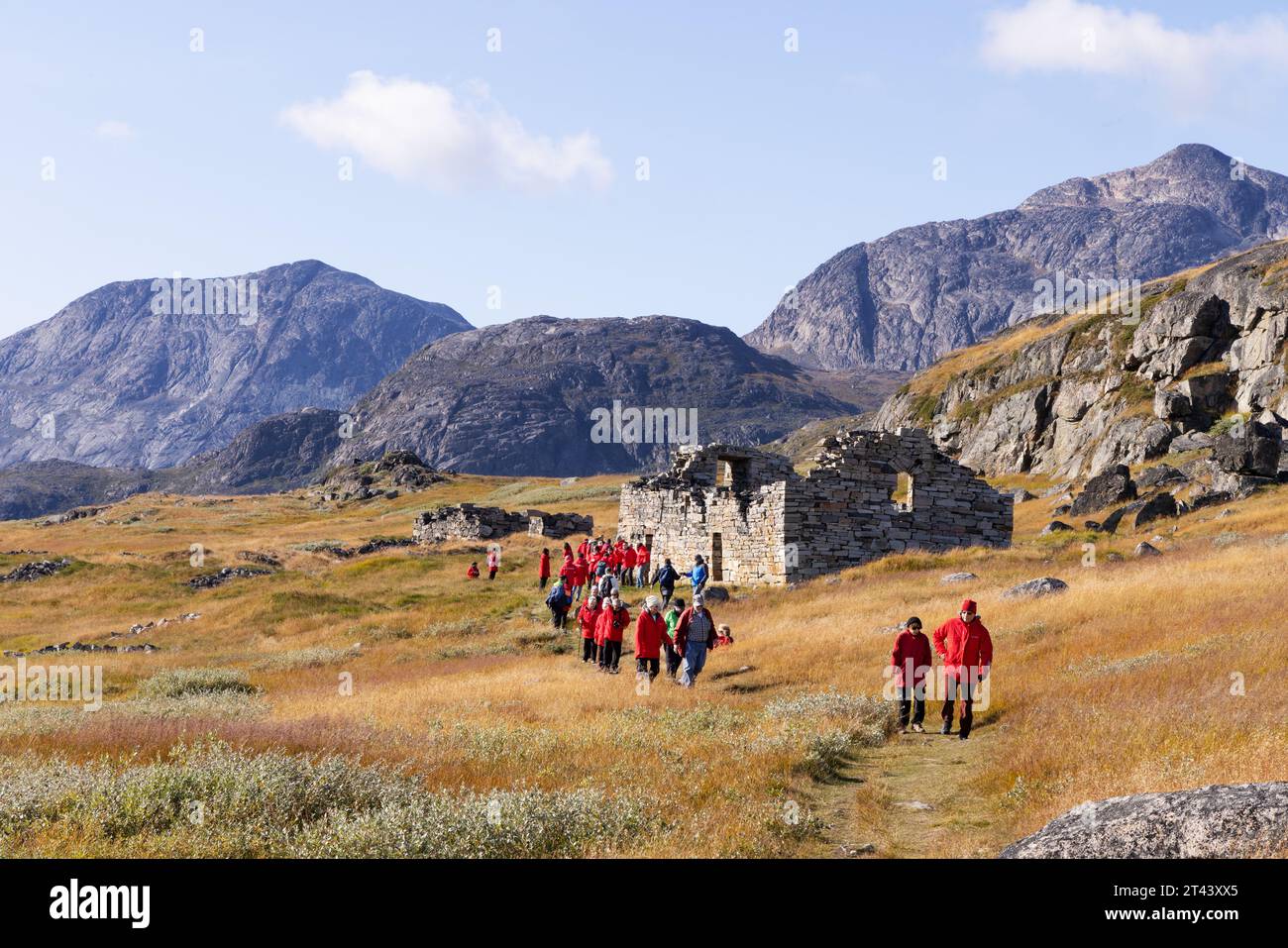 Greenland tourism. people on an arctic cruise at the ruins of Hvalsey ...