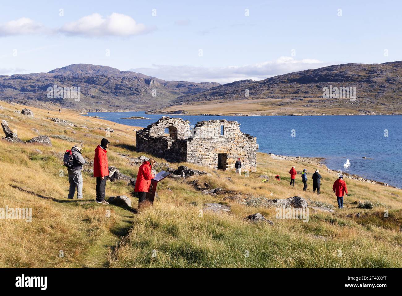 Greenland tourists on an arctic cruise at the ruins of Hvalsey Church ...