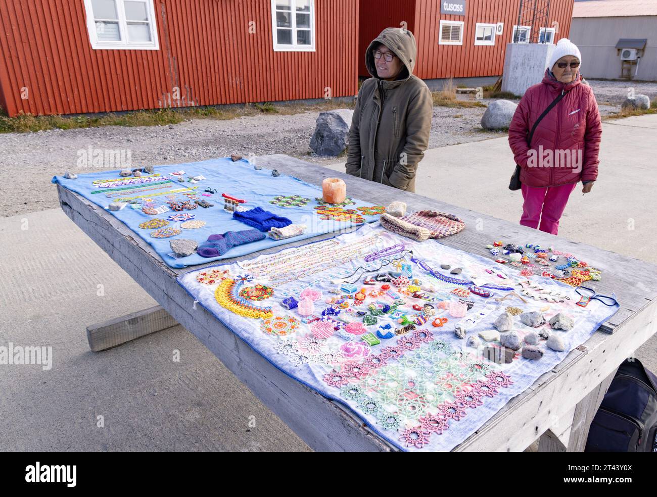 Inuit lifestyle - Inuit women selling tourist souvenirs and crafts from ...