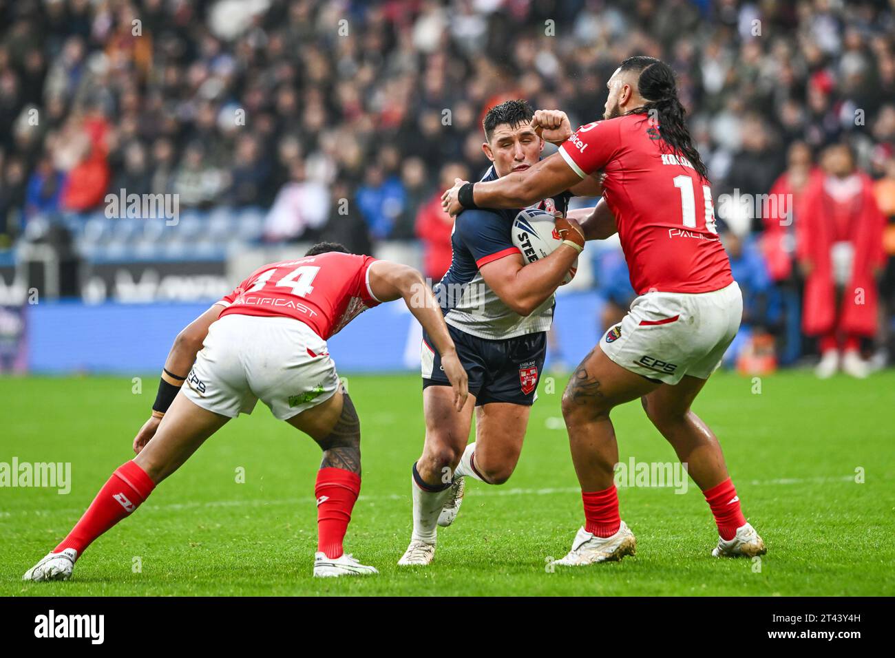 Victor Radley of England is tackled by Keaon Koloamatangi of Tonga ...
