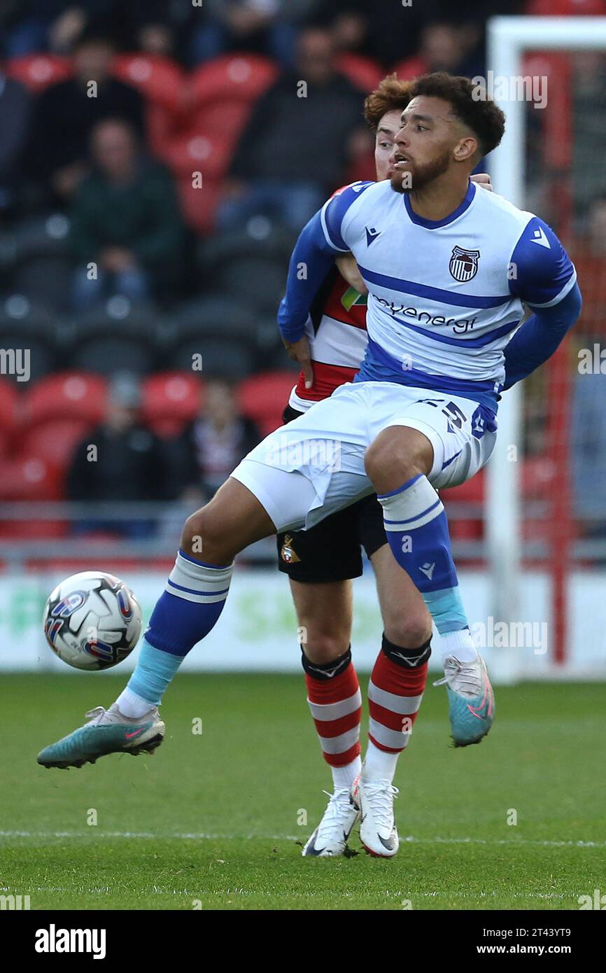 Donovan Wilson of Grimsby Town is held back by Jack Senior of Doncaster ...