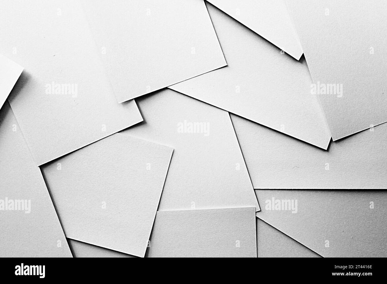 White paper sheets overlay forming abstract whirlpool or aperture light ...