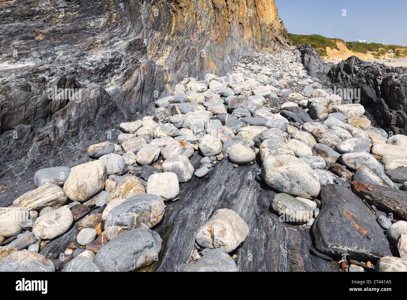 picture with large stones at the foot of a cliff on the Crozon ...