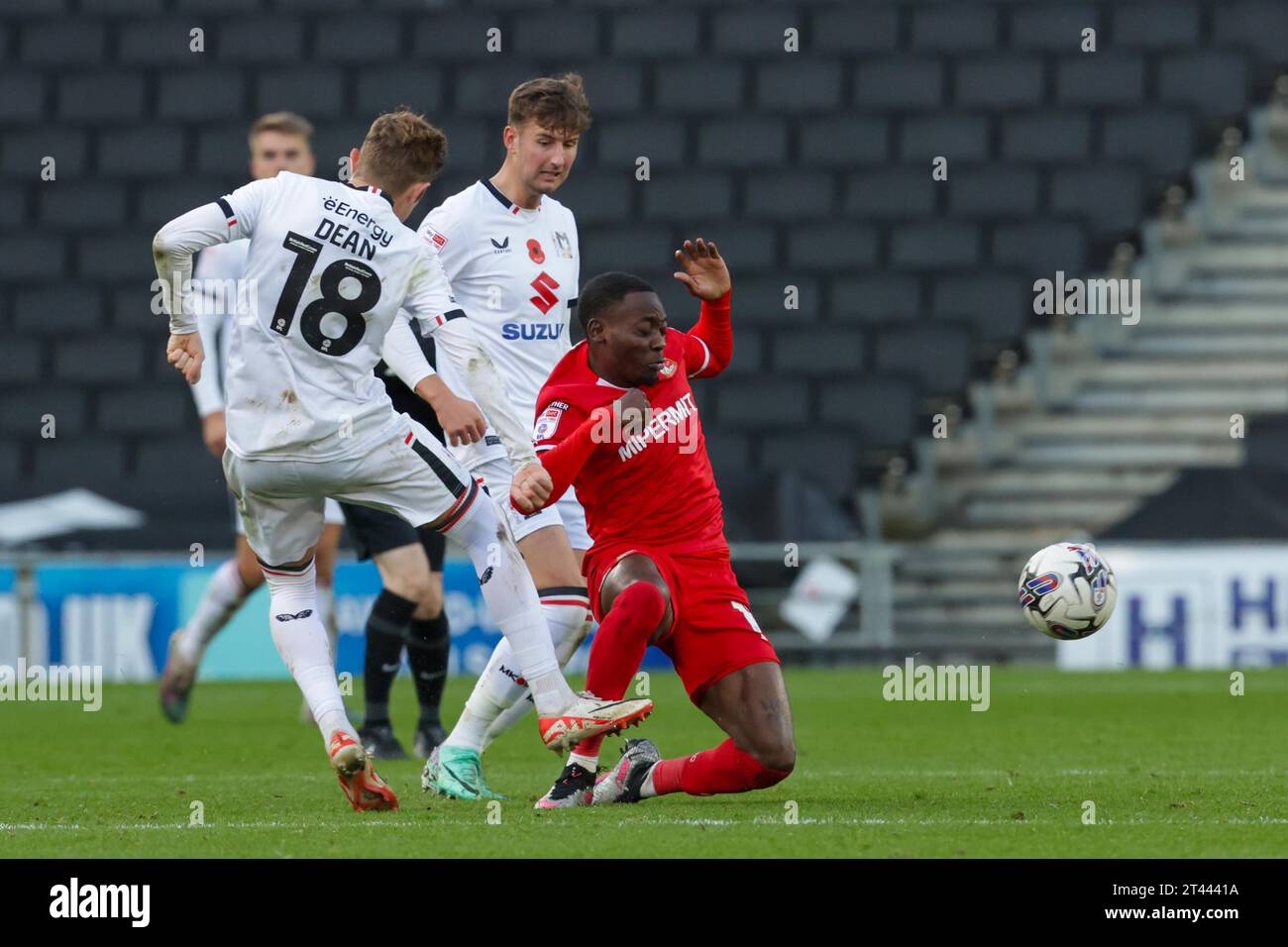 Milton Keynes Dons Max Dean is tackled by Swindon Town's Rushian ...