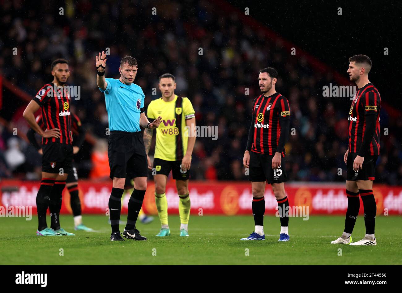 Referee Sam Barrott waits for a VAR check during the Premier League ...
