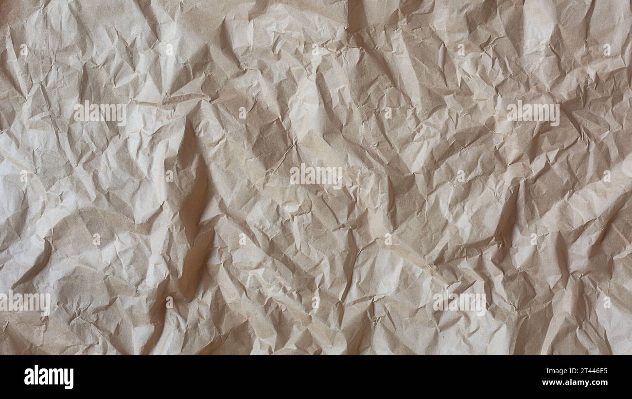 brown crumpled craft paper background texture, abstract of cardboard ...
