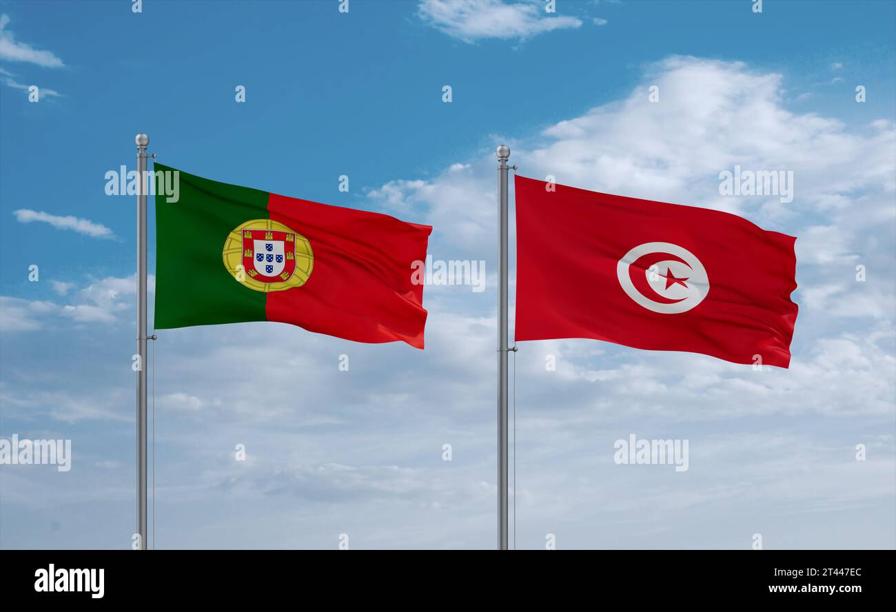 Tunisia and Portugal flags waving together in the wind on blue cloudy sky, two country ...