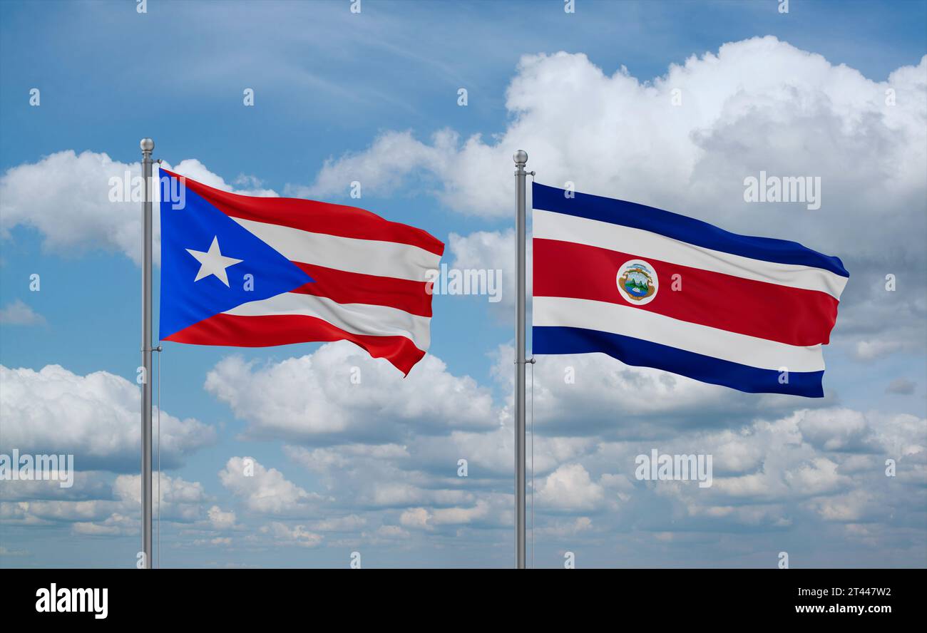 Costa Rico and Puerto Rico flags waving together in the wind on blue cloudy sky, two country ...
