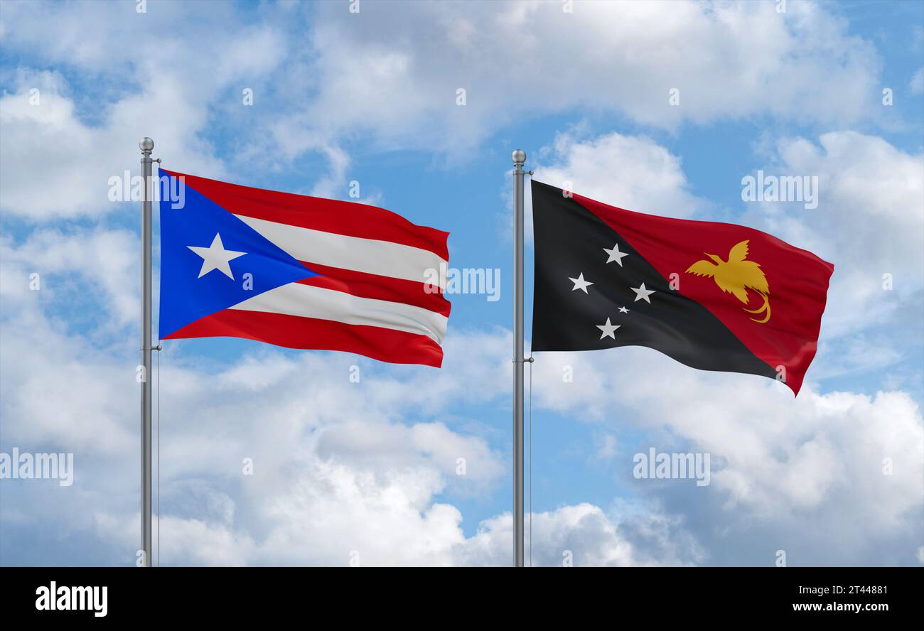 Papua New Guinea and Puerto Rico flags waving together on blue cloudy ...