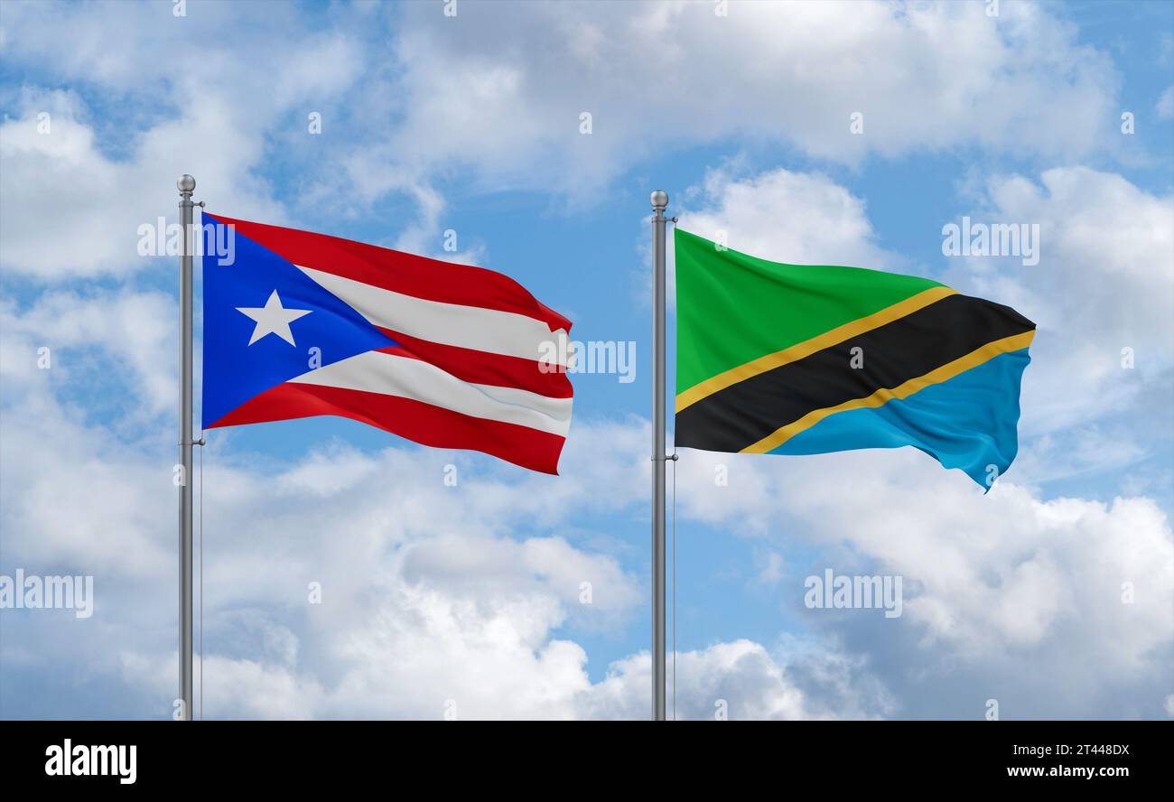Tanzania and Puerto Rico flags waving together in the wind on blue ...