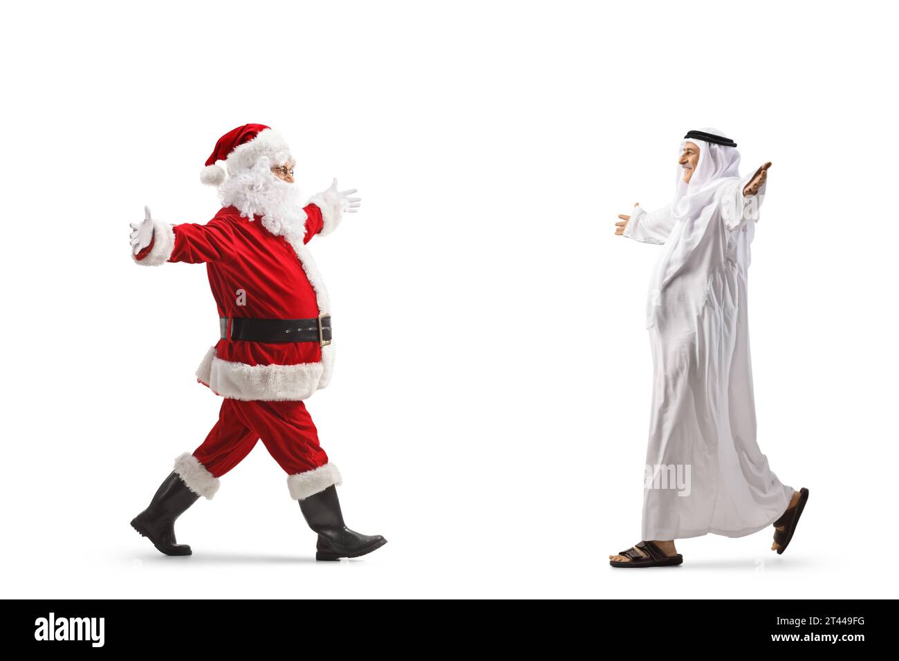 Santa claus walking towards a mature muslim man in ethnic clothes ...