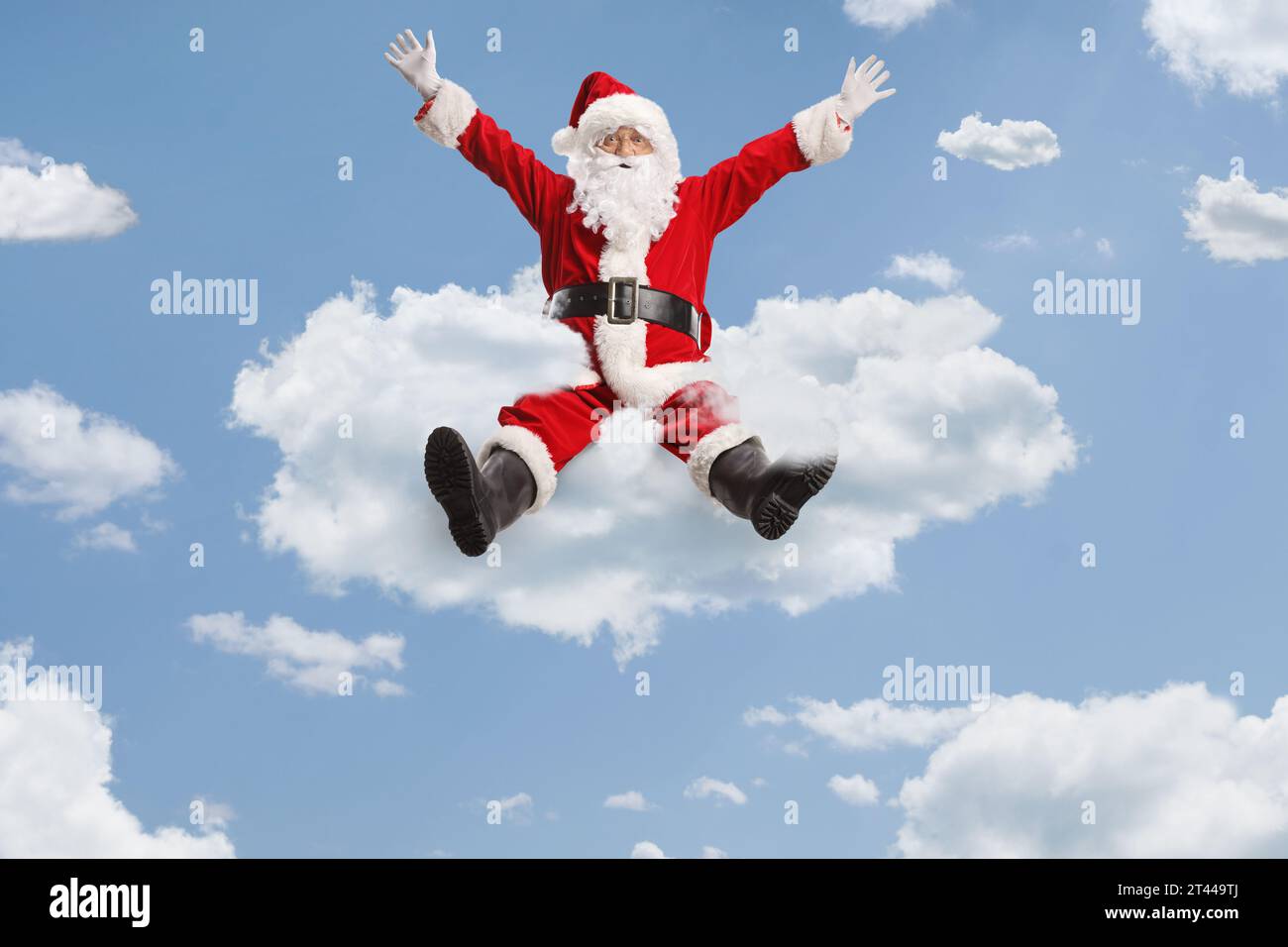 Cheerful santa claus floating on clouds up in the sky Stock Photo - Alamy