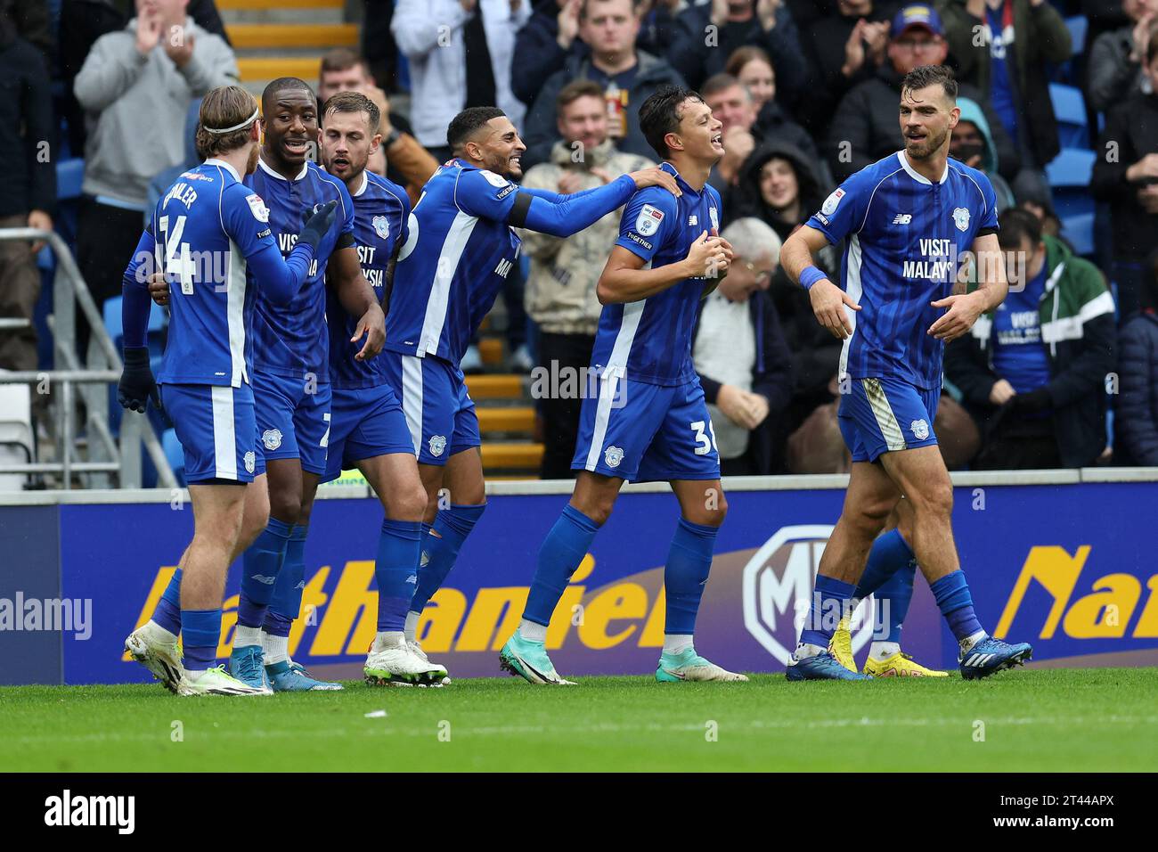 Cardiff, UK. 28th Oct, 2023. Perry NG of Cardiff city (2 R) celebrates ...
