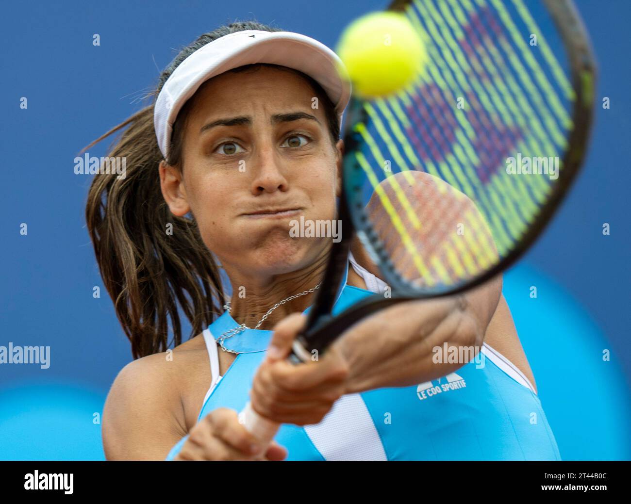 Argentina's Lourdes Carle hits a return on her way to defeating Canada ...