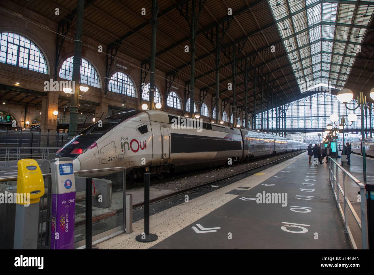 Paris, France. Trains at the Gare du Nord SNCF railway station platform ...