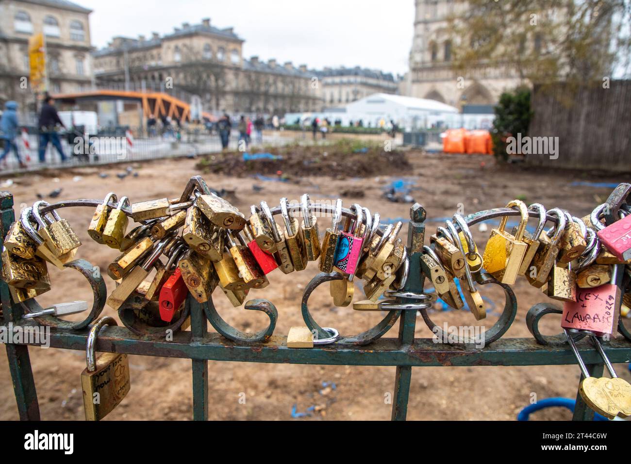 Love locks adorn the railing along the Seine River near the iconic ...