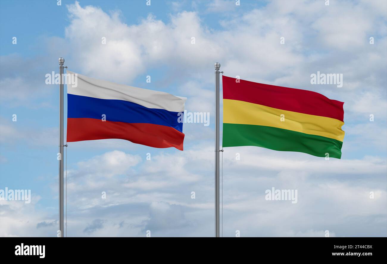 Bolivia and Russia flags waving together on blue cloudy sky, two ...